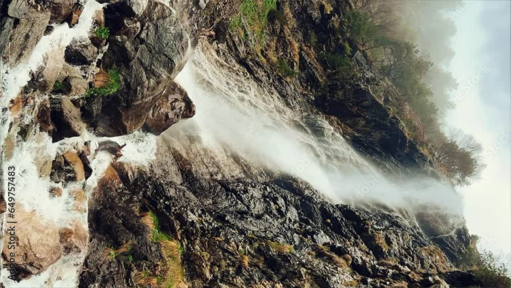 Hares waterfall in rainy weather in the mountains. A thick fog is ...