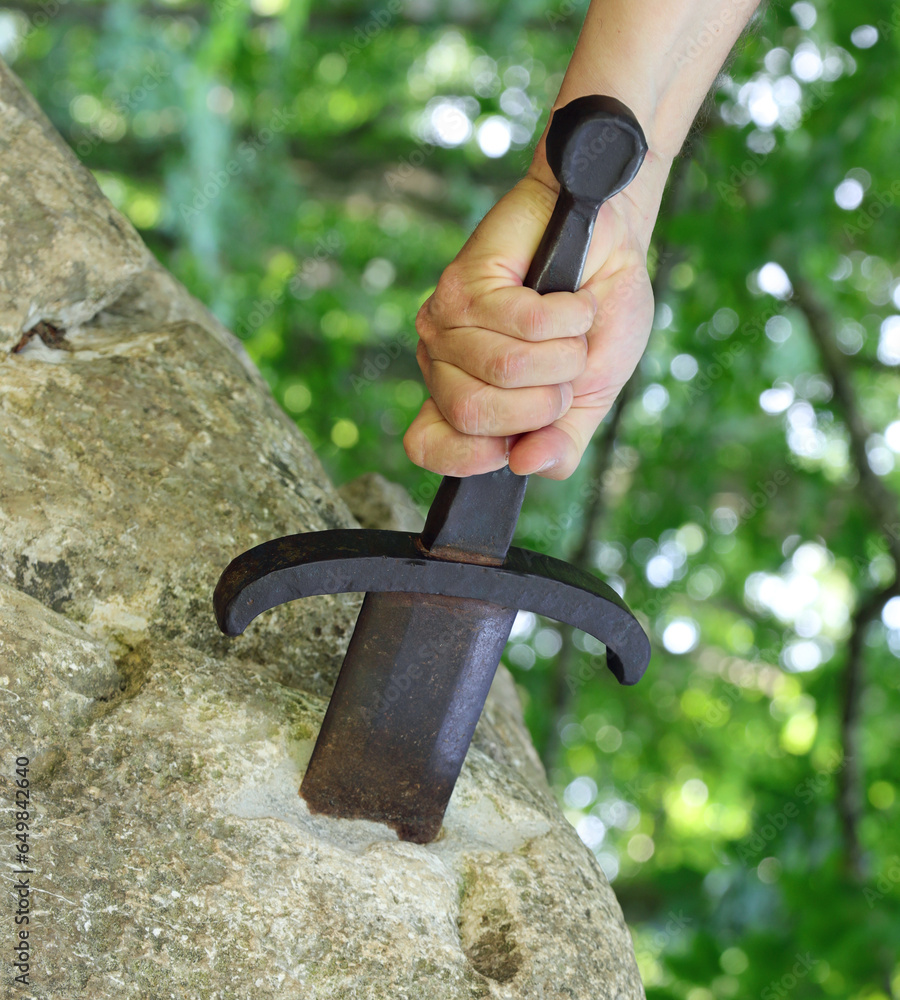 sword in the rock as in the story of King Arthur Stock Photo | Adobe Stock