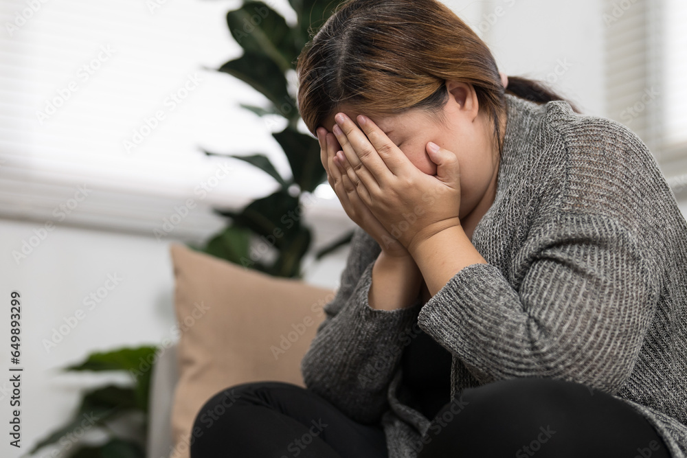 Sad Overweight plus size woman thinking about problems on sofa upset ...