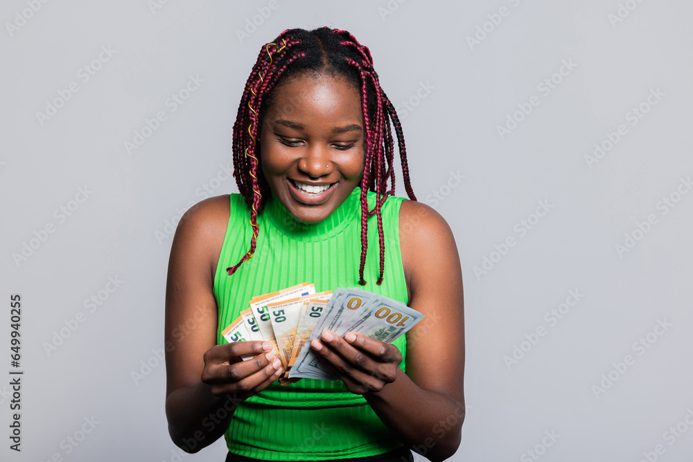 African American dark skinned young delighted curious woman in casual ...