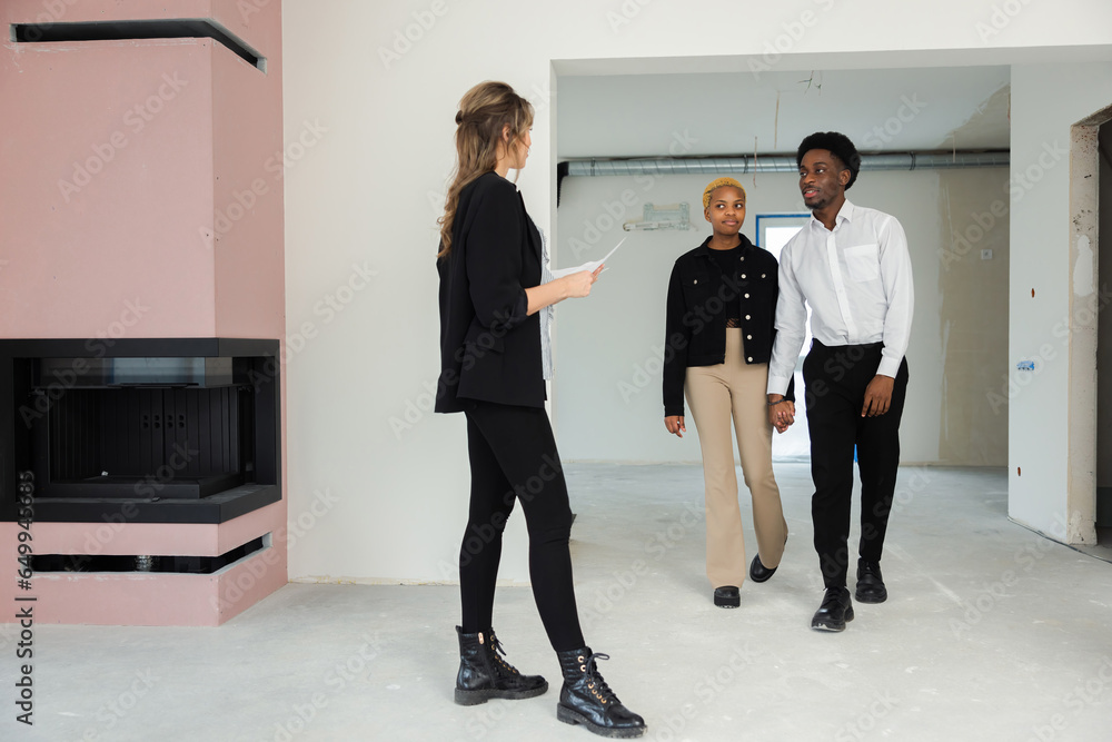 Blonde woman realtor is conducting a thorough tour of the clients ...