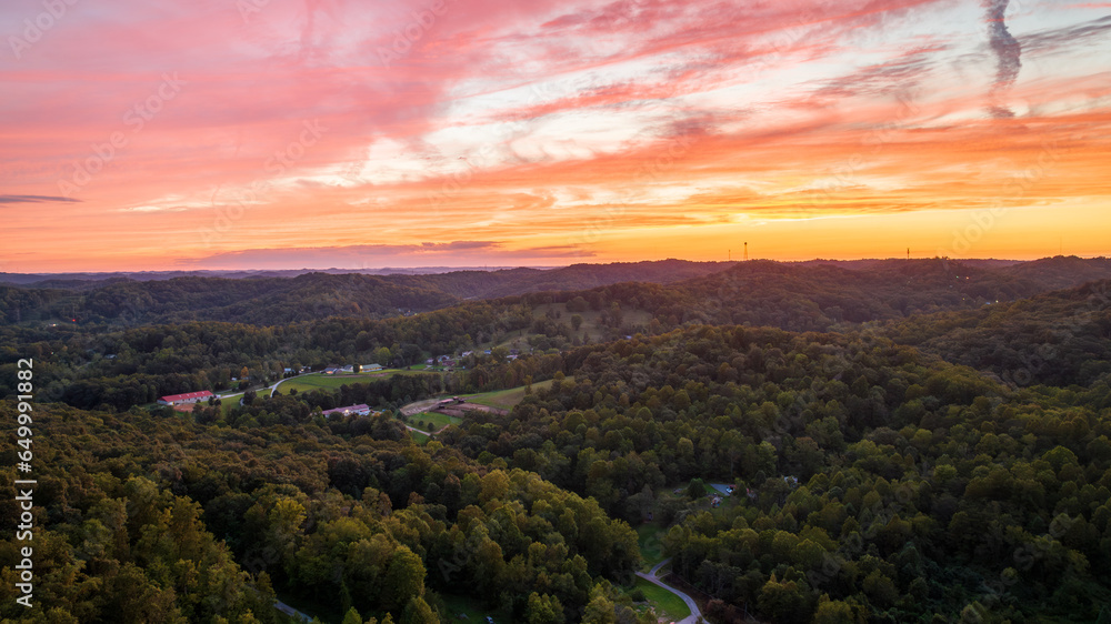 Golden Hour Glory: Aerial Perspective of a Forest Bathed in Sunset Hues ...