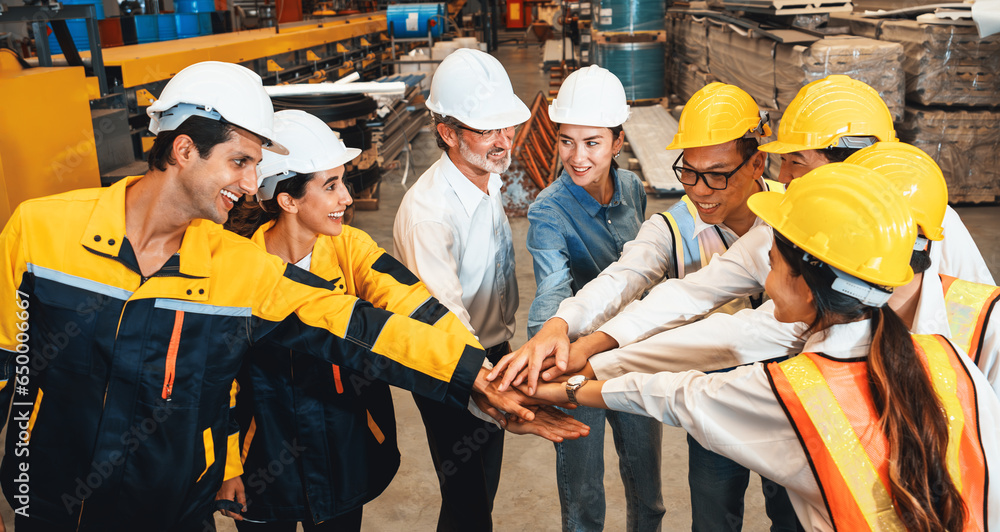 Cohesive and race diversity group of factory worker joining hands ...
