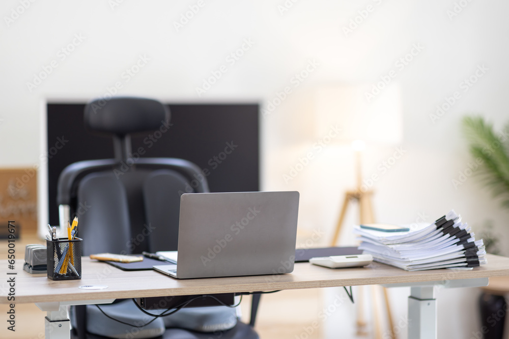 Laptop Computer, notebook, and eyeglasses sitting on a desk in a large ...