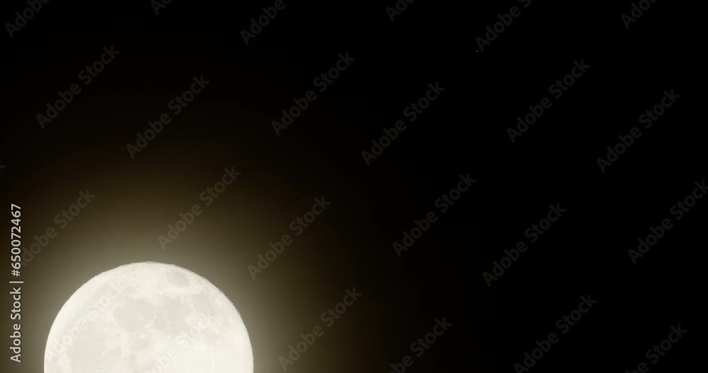 Moonrise in the black night sky. Fantastic fairy moon. Clear video with ...