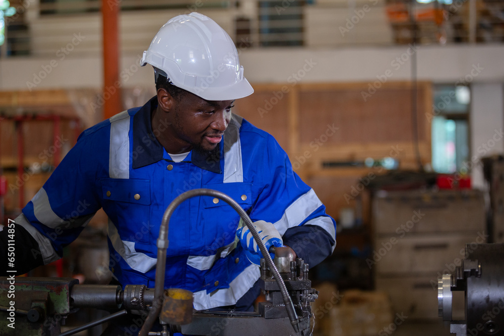 Male African American workers wearing uniform safety and hardhat ...