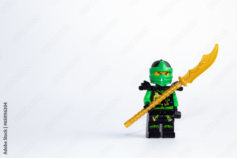 LEGO Ninjago Lloyd character with two hand sword against white backdrop ...