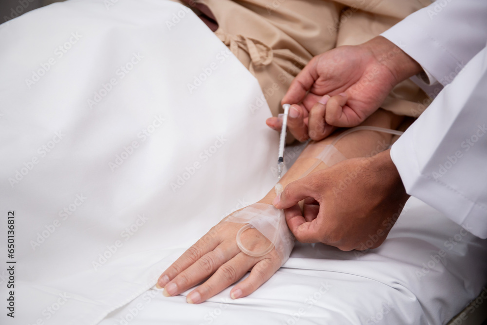 Hands of doctor hold syringe needle insulin with preparing vaccinate ...