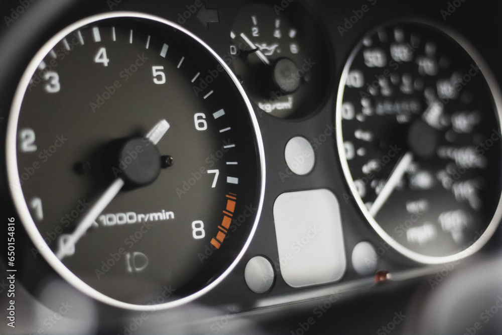 Close up photo of modern classic car gauges showing speedometer and ...