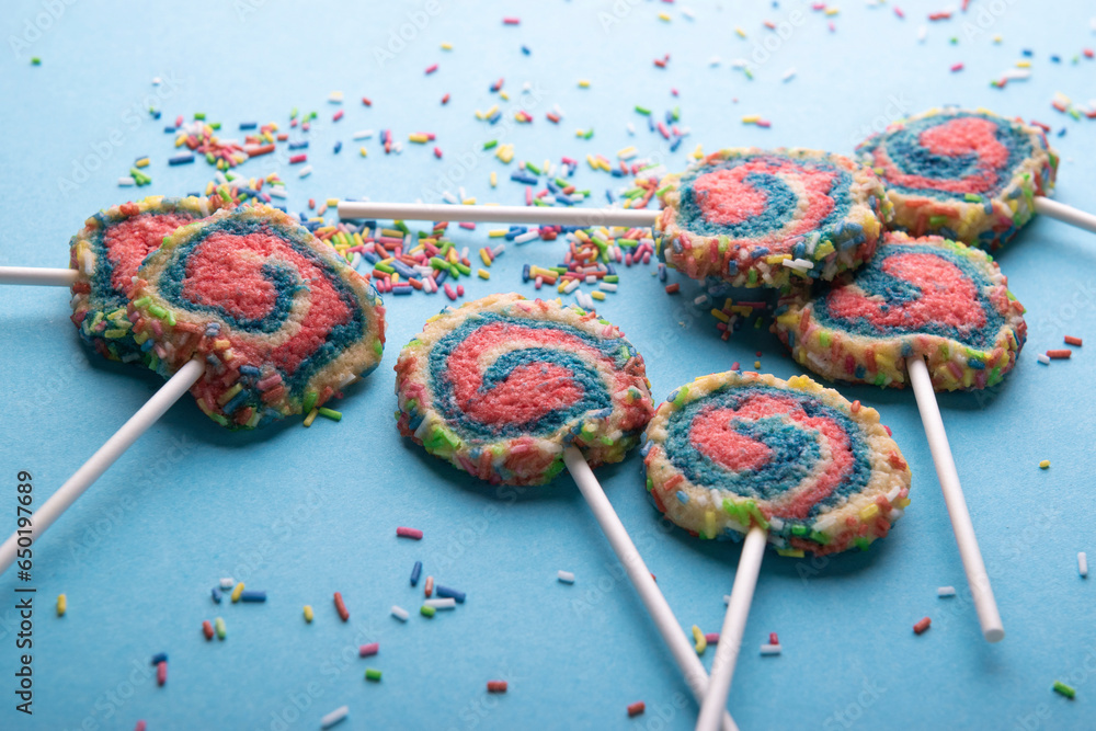 Vegan shortbread biscuits with colourful sugar sprinkles on a stick ...