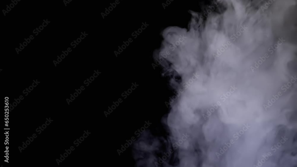 White Ice Cloud of Thick Smoke Dissolves on a Black Background in Empty ...