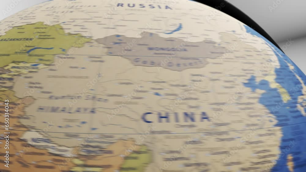 Atlas map of the world globe spinning zooming in and focusing on the ...