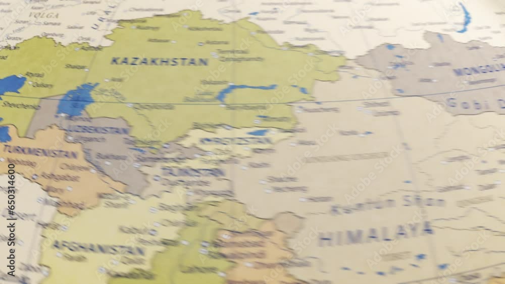 Atlas map of the world globe spinning zooming in and focusing on the ...