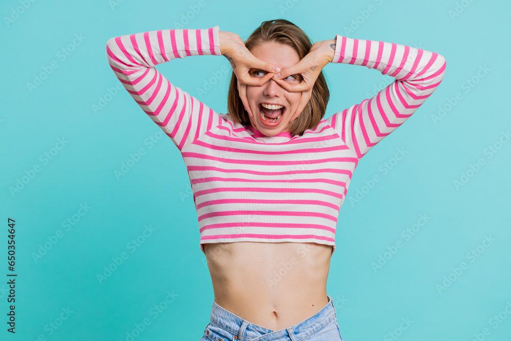 Funny comical playful young woman making silly facial expressions and ...