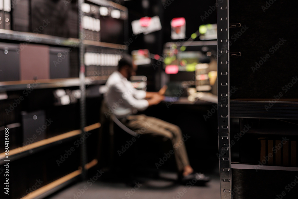 Blurred investigator solving crime, sitting at workplace table in ...