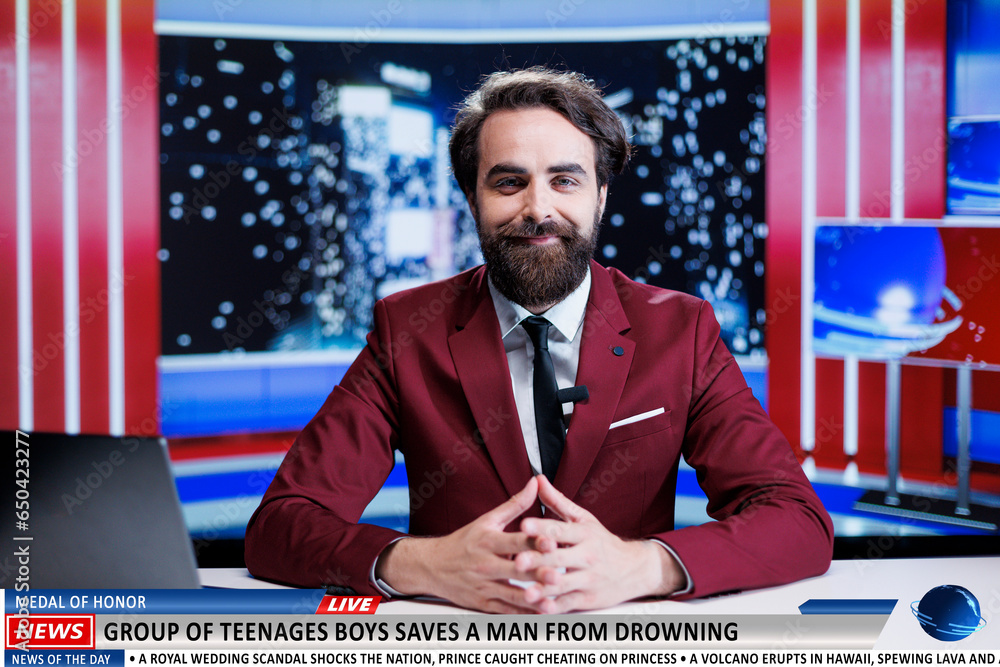 Newscaster reporting live story about teenagers saving person from ...