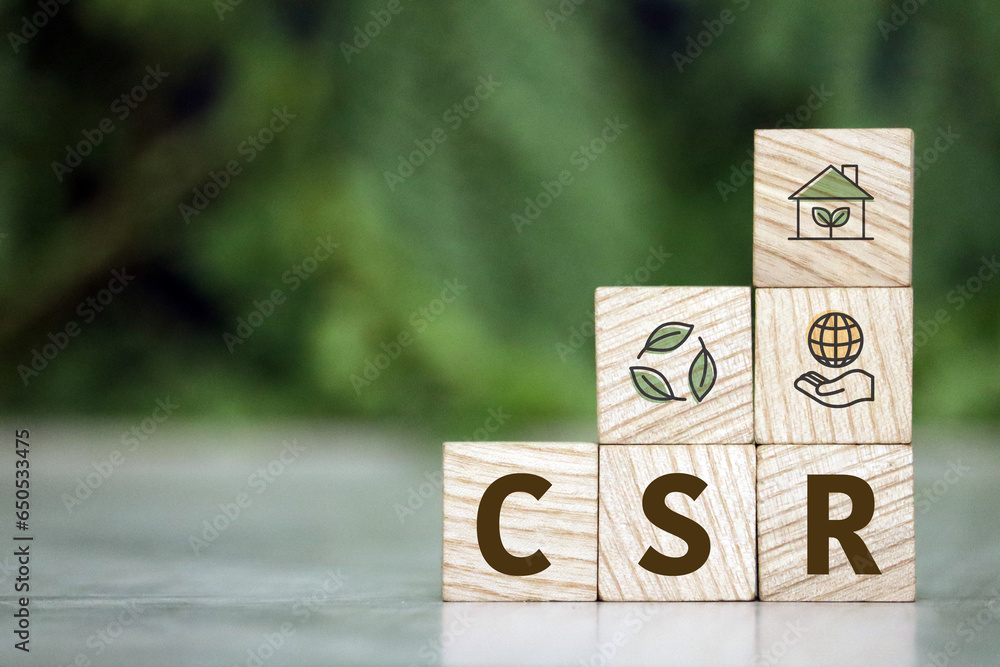 CSR Corporate Social Responsibility, CSR and Sustainability Responsible Office. Wooden cube with ...