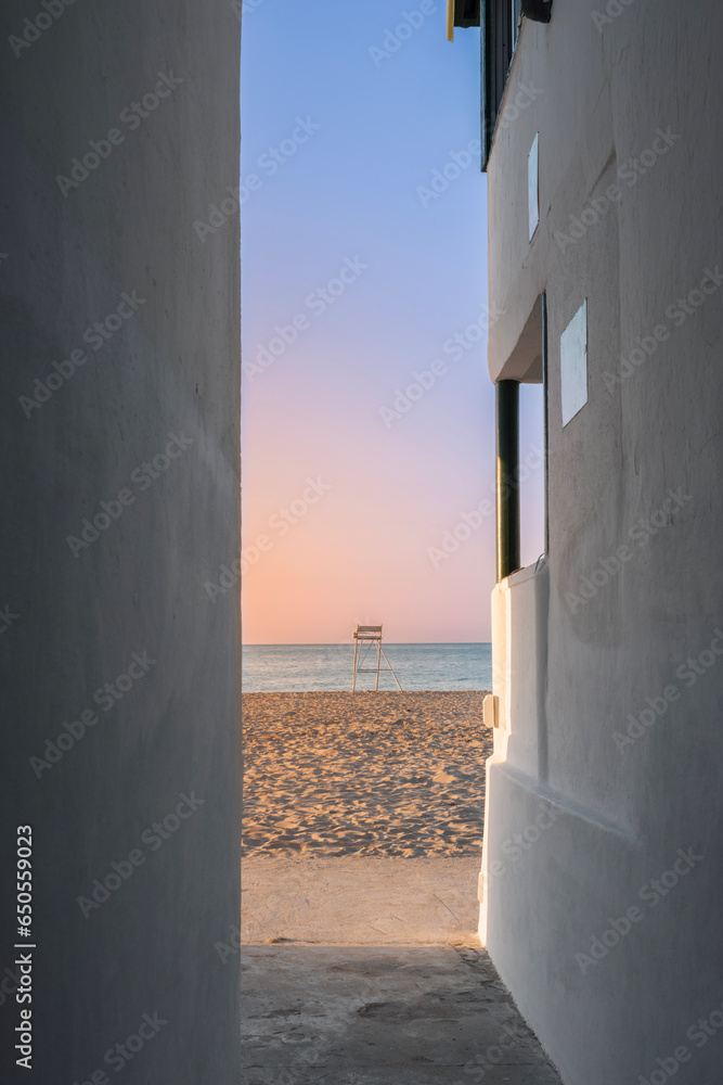Sunrise on the beach with lifeguard chair room for text - Coastal ...