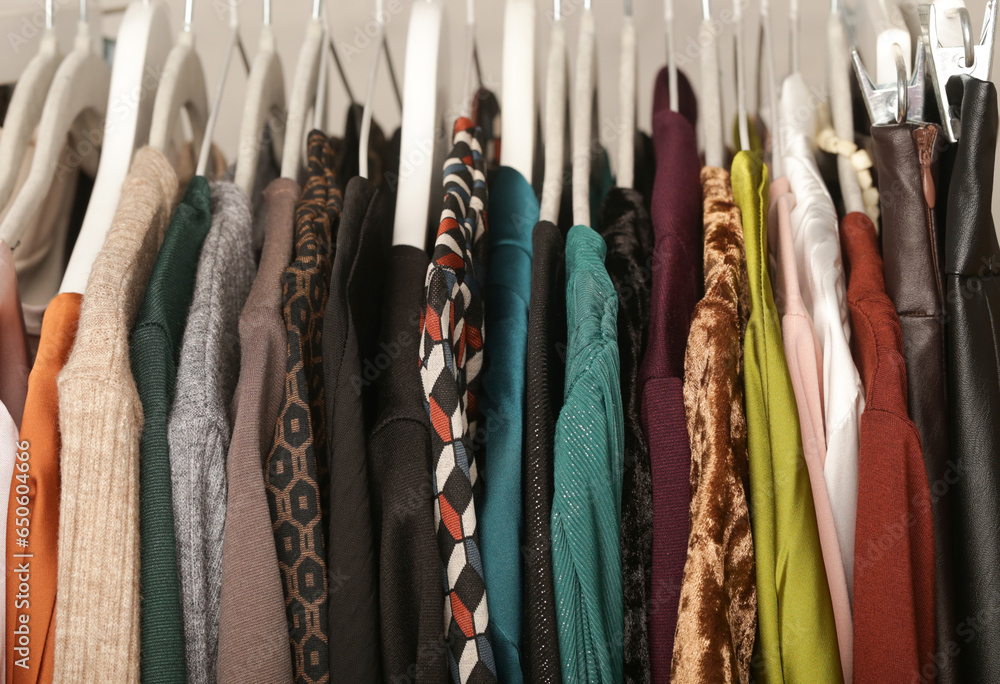 Women's fashion. Different clothes on hangers, close up. Huge selection ...