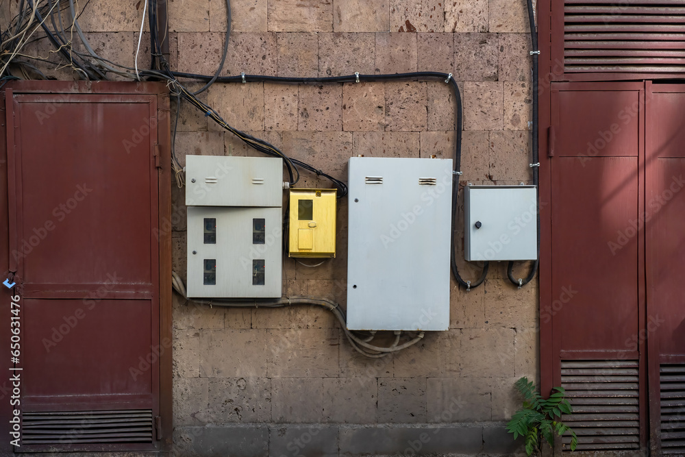 Foto de Power shields on facade of building. Wall of house with ...