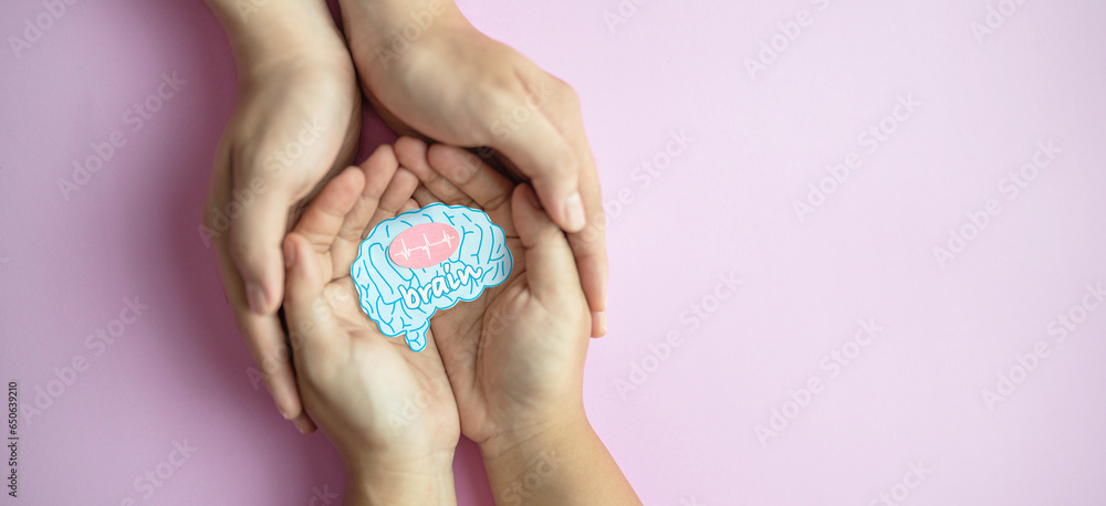 " brain " text from paper in adult hands on pastel background ...