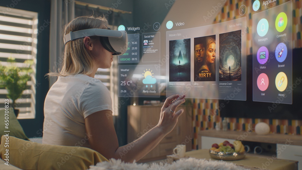 Woman in augmented reality headset chooses movie or TV show to watch at ...