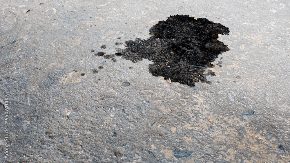 Abstract black engine oil drop on concrete floor texture backgruond ...