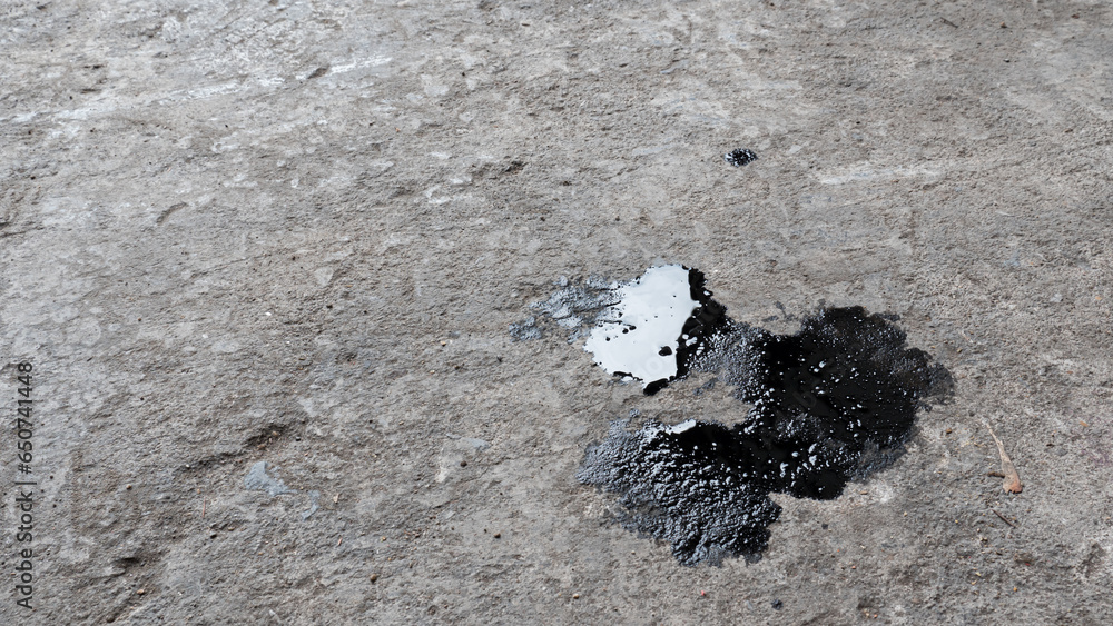 Abstract black engine oil drop on concrete floor texture backgruond ...