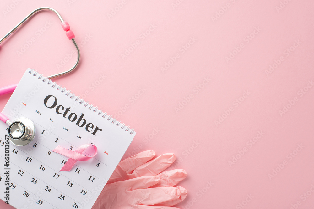 Breast cancer screening reminder. Overhead shot of pink surgical gloves ...