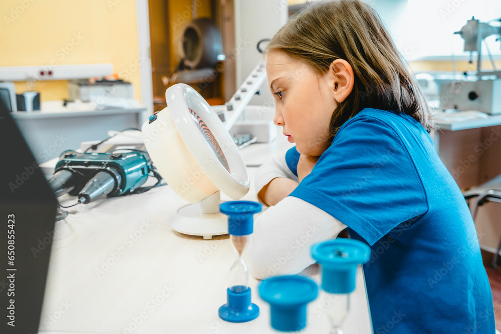 Little girl in medical office undergoing advanced laser vision ...