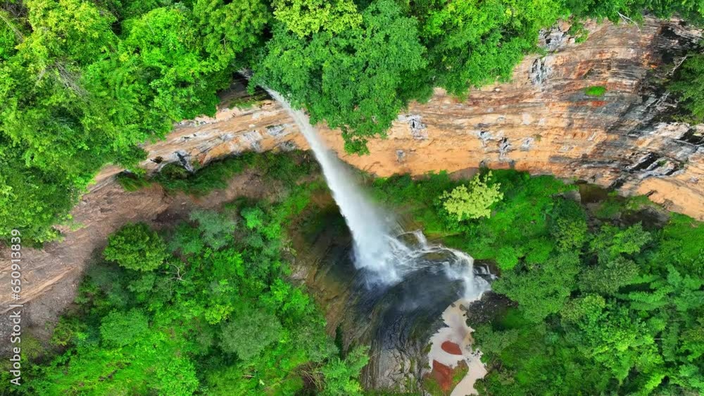 The cliff from which the waterfall descends is a formidable natural ...