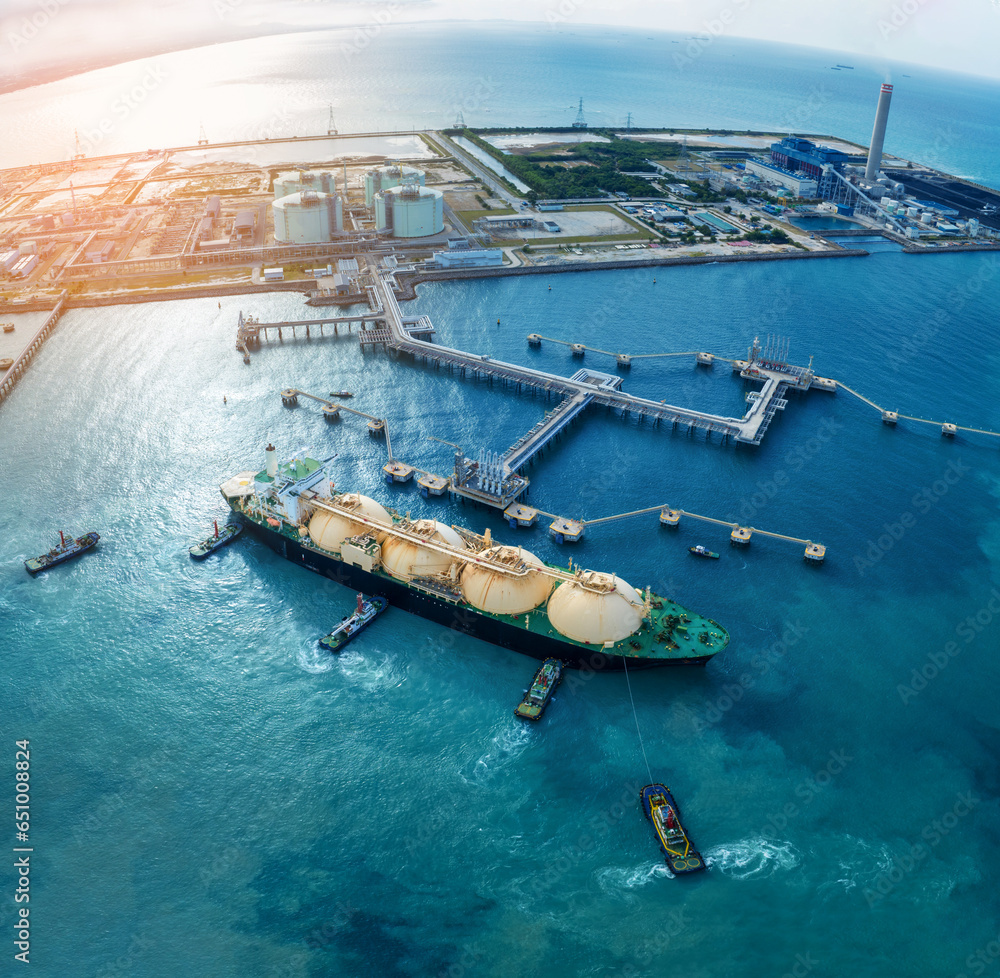 LNG (Liquefied natural gas) tanker anchored in Gas terminal gas tanks ...