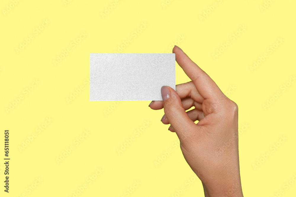 Female Hand Holding White Business Card Isolated On Yellow Studio ...