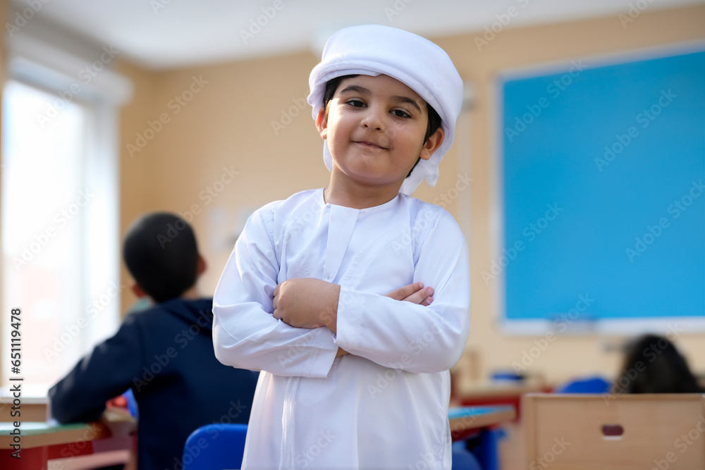 Foto de Arab Emirati boy student portrait wearing traditional middle ...