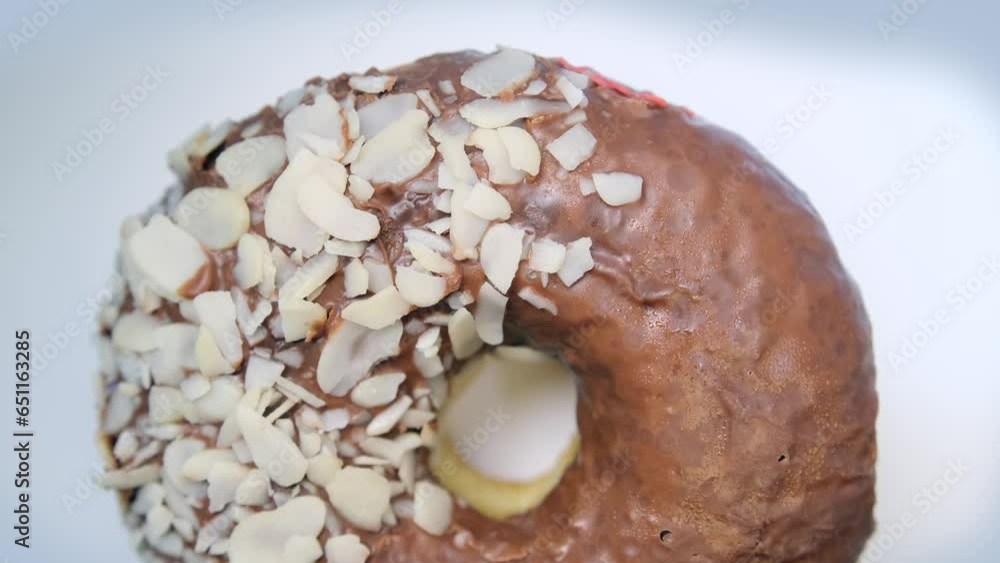 Brown cocoa glaze donut. Moving away and approaching close-up of a ...