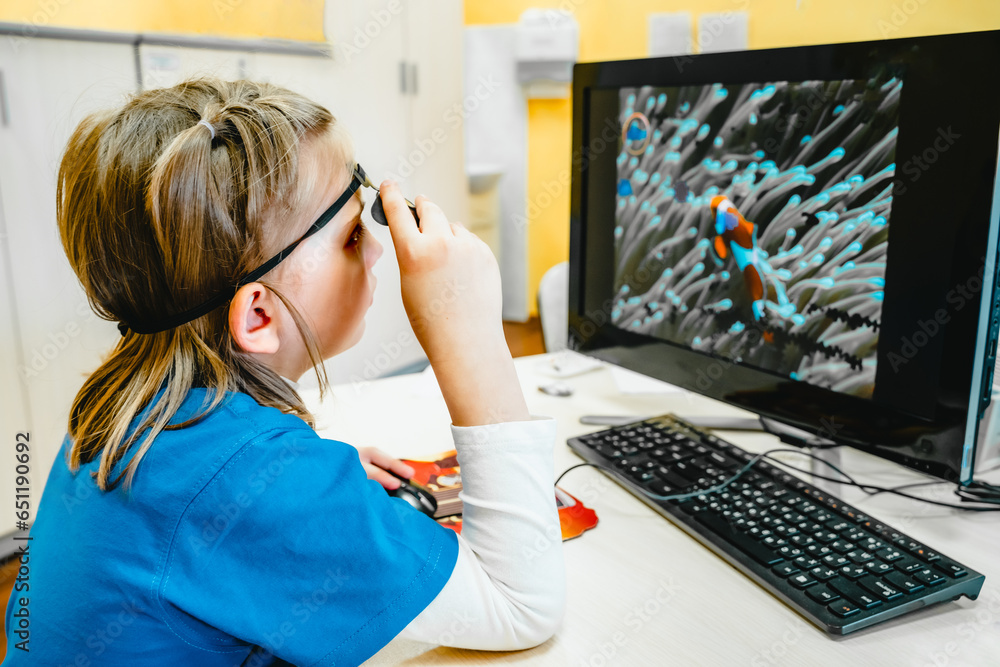Little girl in medical office undergoing advanced laser vision ...
