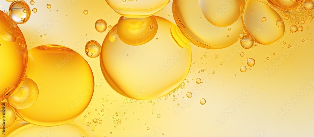 Cooking oil forms yellow bubbles on water isolated pastel background ...