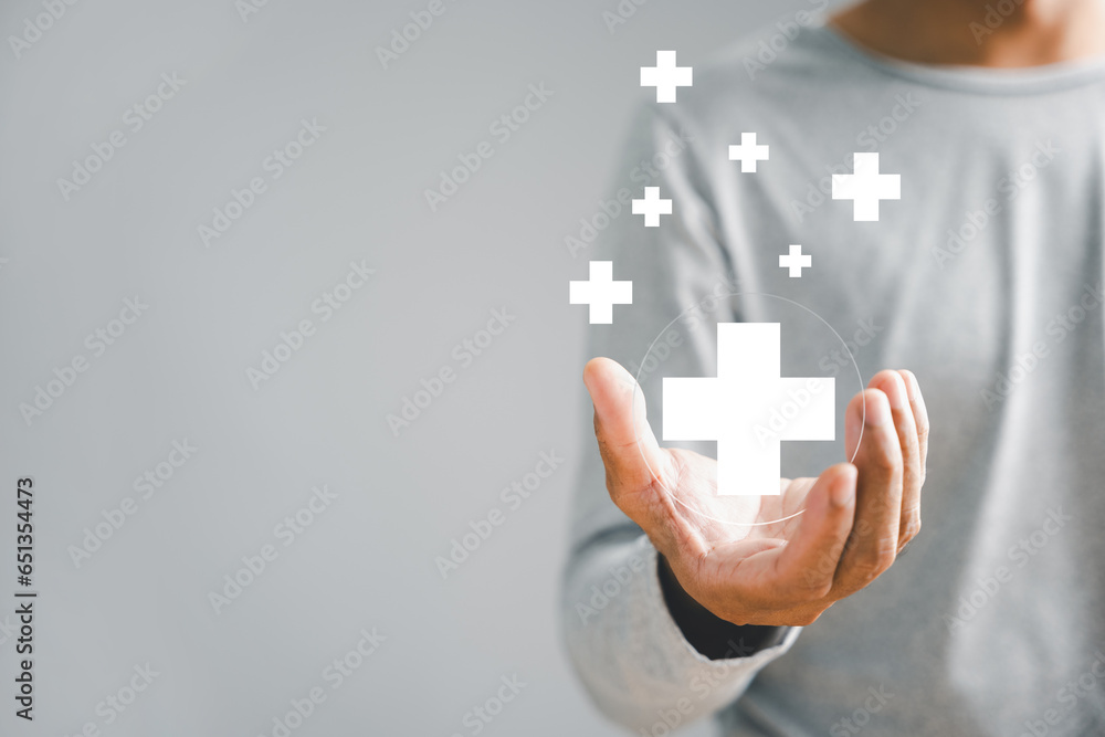 Features a businessman hand gripping a plus sign, indicating positive ...