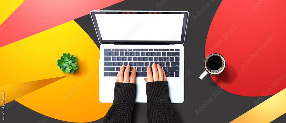 Person using a laptop computer from above Stock Photo | Adobe Stock