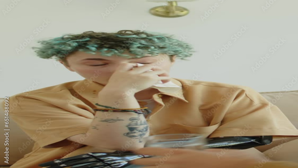 Vertical shot of depressed gen Z girl with prosthetic arm crying ...