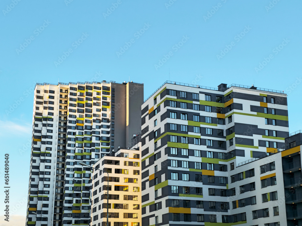 Sunny evening light on the facade of a multi-storey building. Facade ...