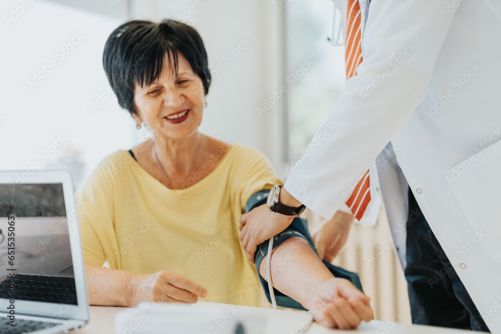 Experienced cardiologist examines elderly patient's heart. Doctor ...