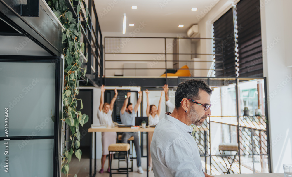 Teamwork leads to success! Employee working alone and struggling while ...