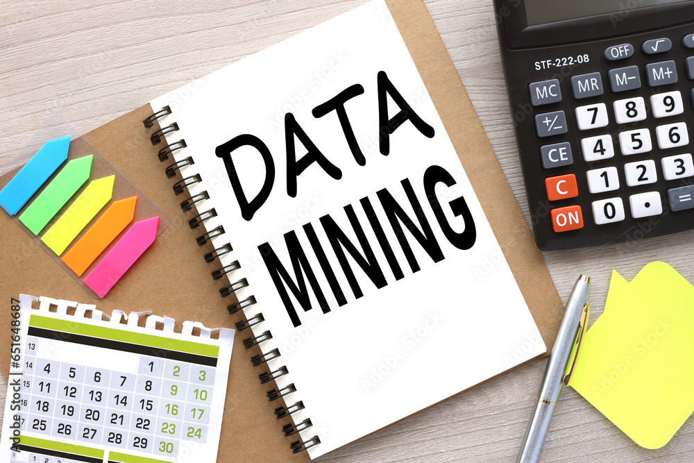 Data mining open notebook with stickers and a calendar for the month ...