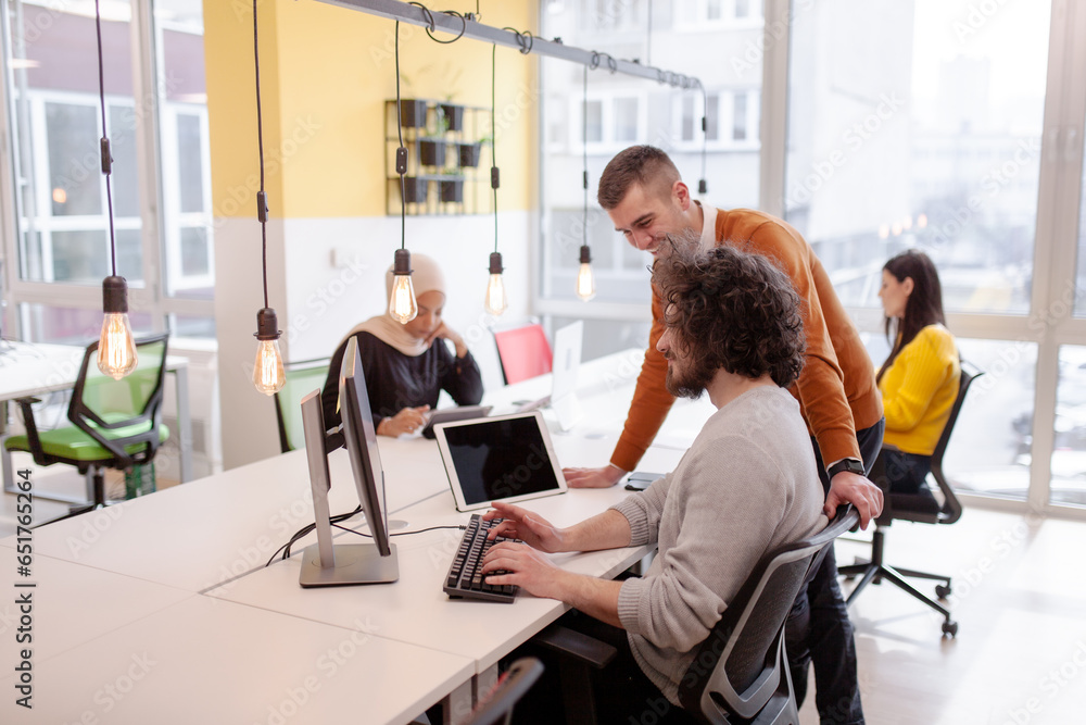 Business people having conversation in front of a computer. Modern ...