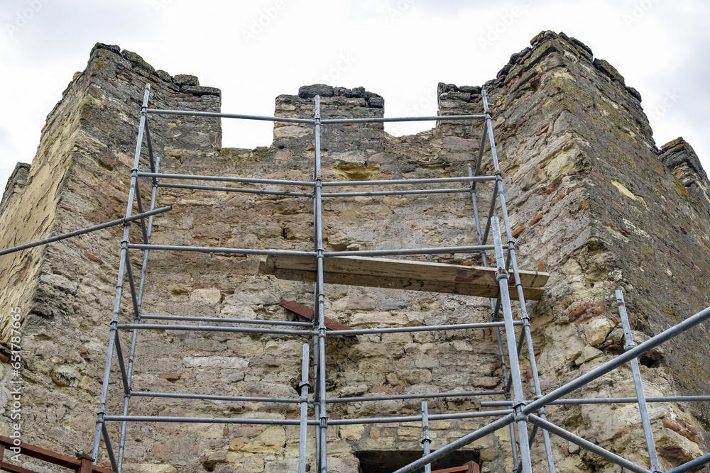 Carrying out restoration work in the ancient medieval fortress. Metal ...