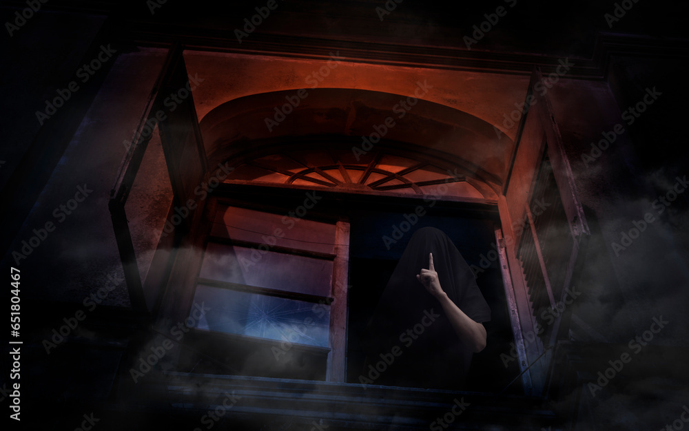 Grim reaper showing silence sign with finger standing in old ancient ...