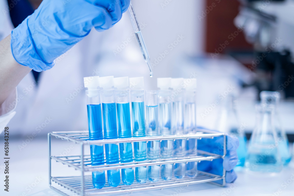 Blue glass test tube glassware liquid sample pipette equipment in ...