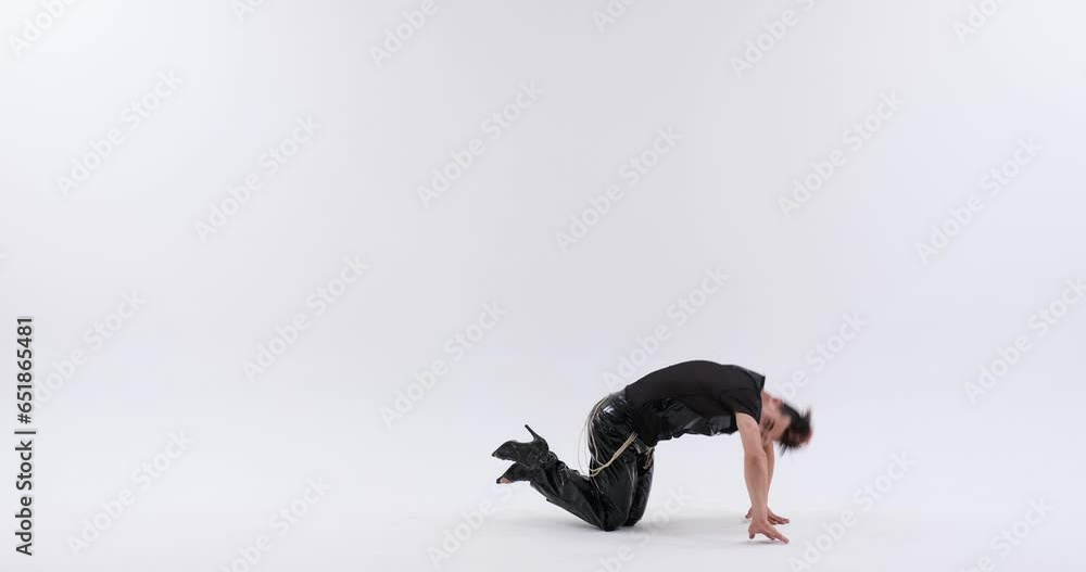 A graceful individual of Caucasian heritage channels their creativity ...