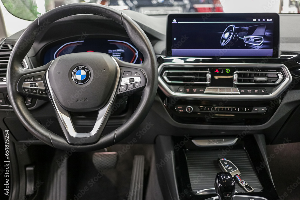 BMW X5 steering wheel and dashboard. Black leather car interior ...
